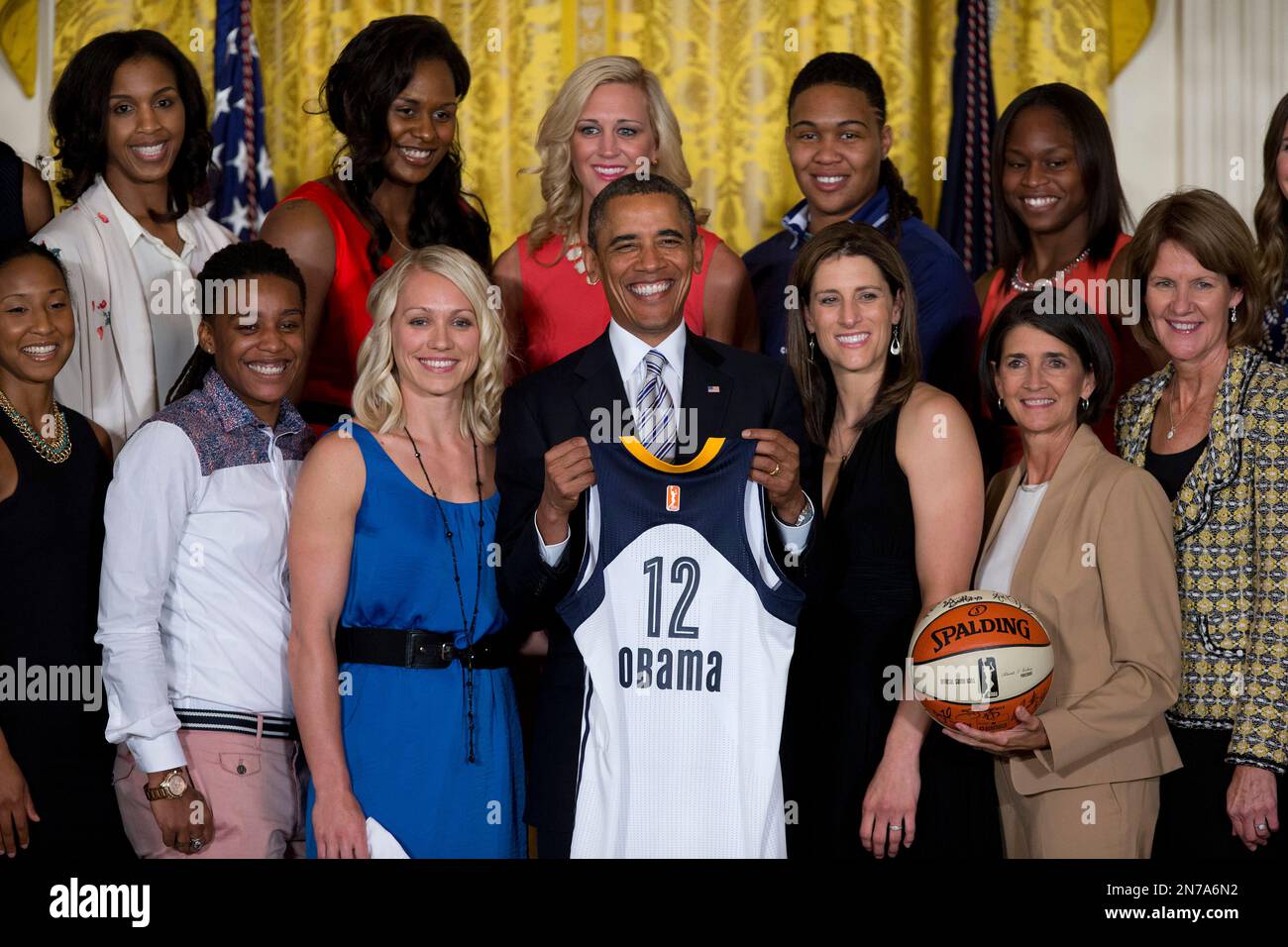 President Barack Obama holds up a Indiana Fever team basketball jersey ...