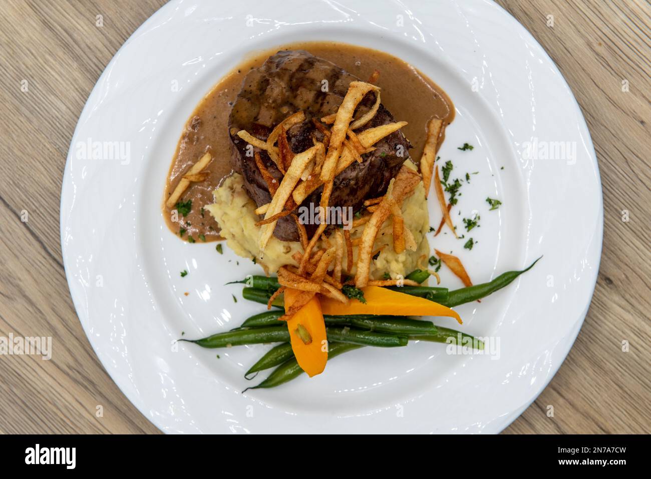 Overhead view of tempting dinner of grilled to perfection beef sirloin ...