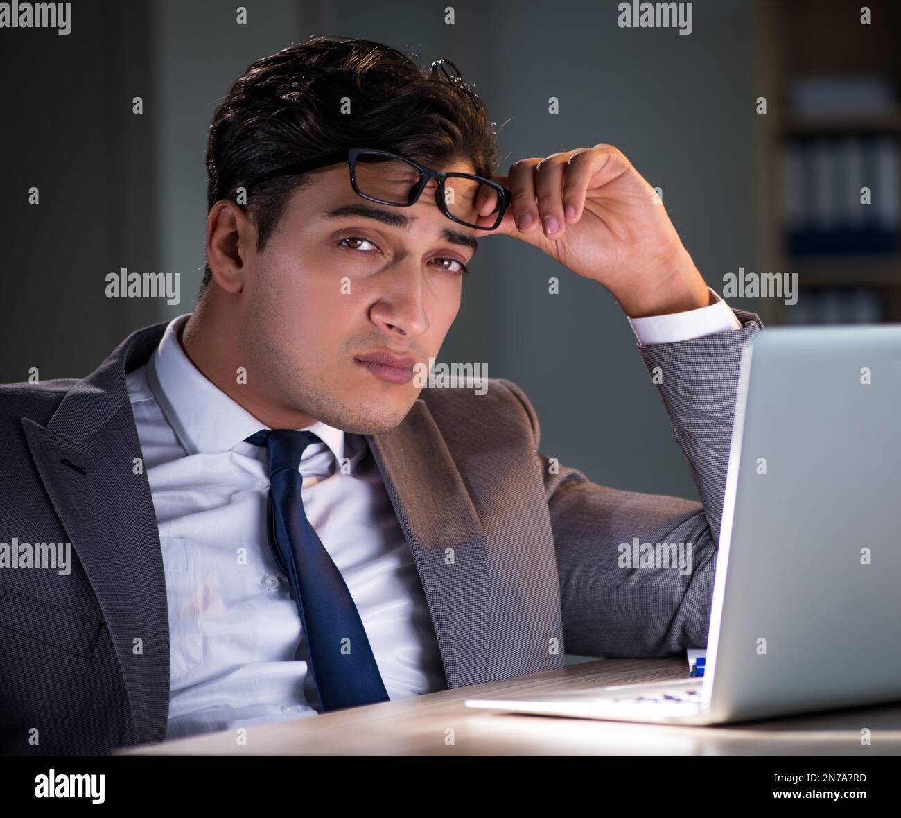 The man staying in the office for long hours Stock Photo - Alamy