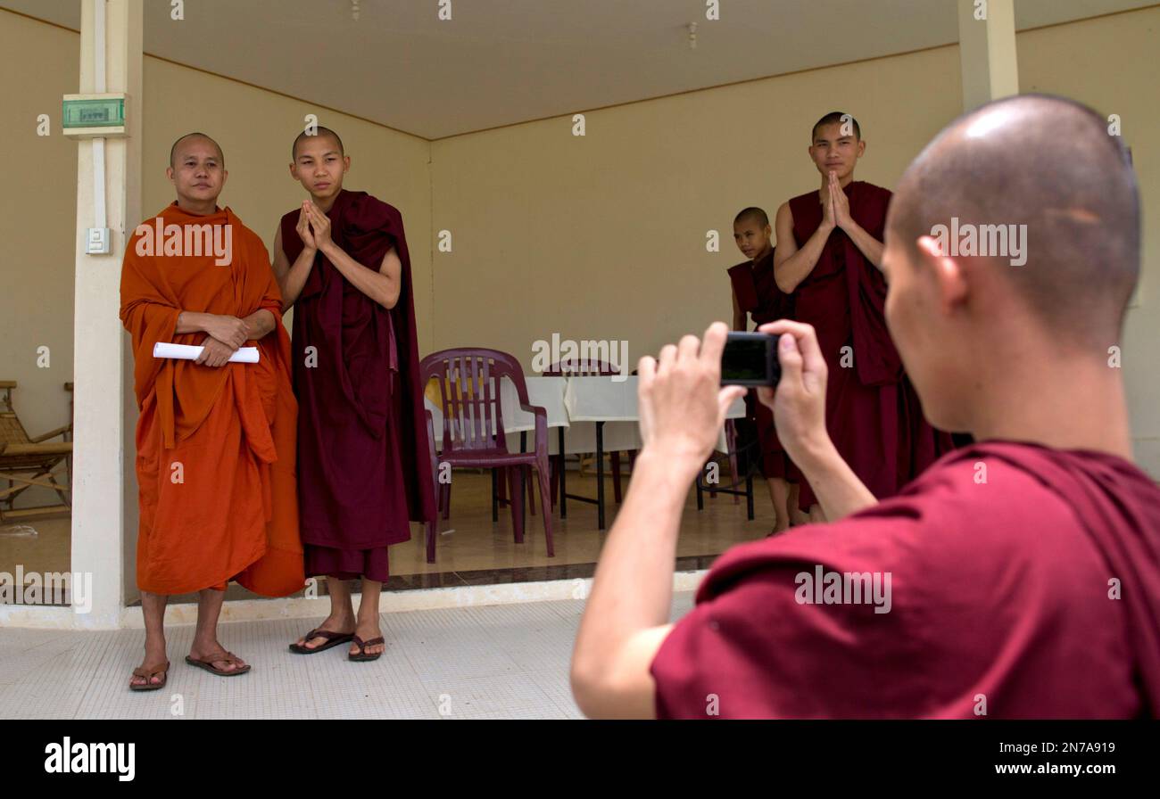 Novice Buddhist monks take pictures with controversial Buddhist monk ...