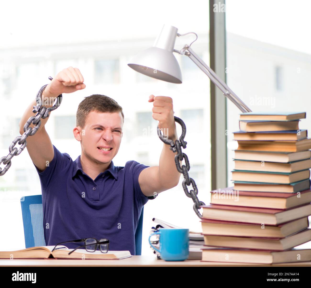 The young student forced to study tied Stock Photo - Alamy