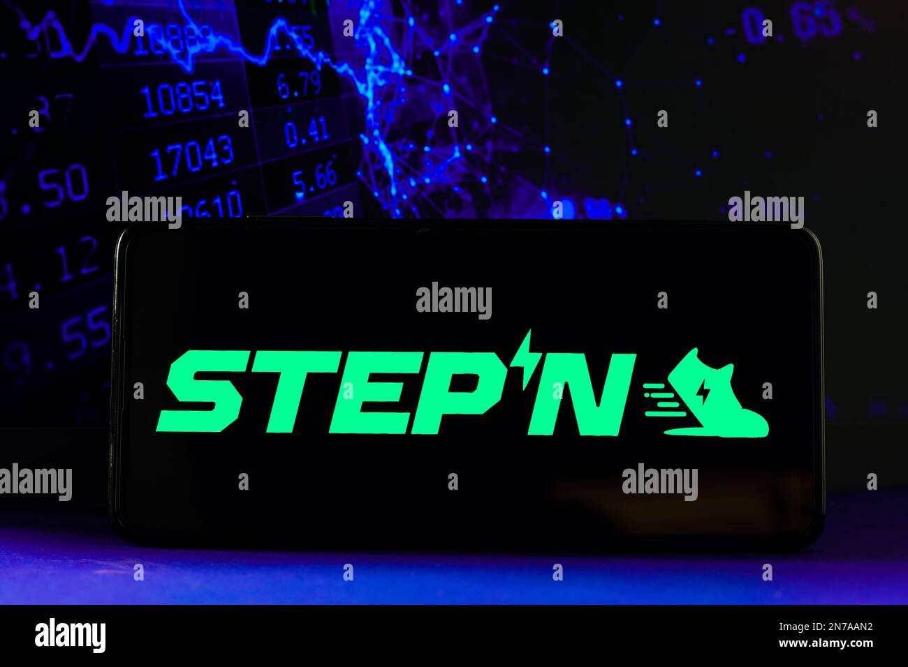 In this photo illustration the STEPN logo seen displayed on a ...