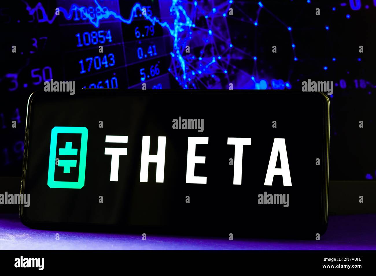 In this photo illustration the Theta Network logo seen displayed on a ...
