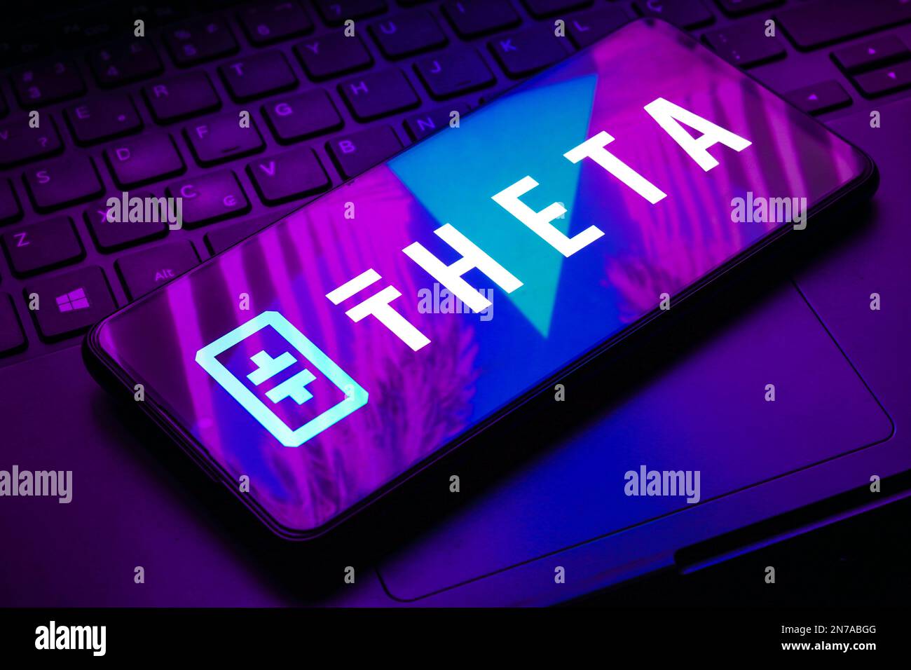 In this photo illustration the Theta Network logo seen displayed on a ...