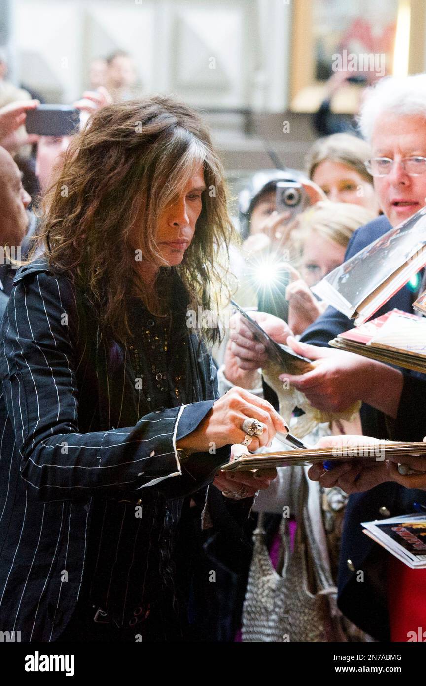 Inductee Steven Tyler signs autographs as he arrives to the Songwriters ...