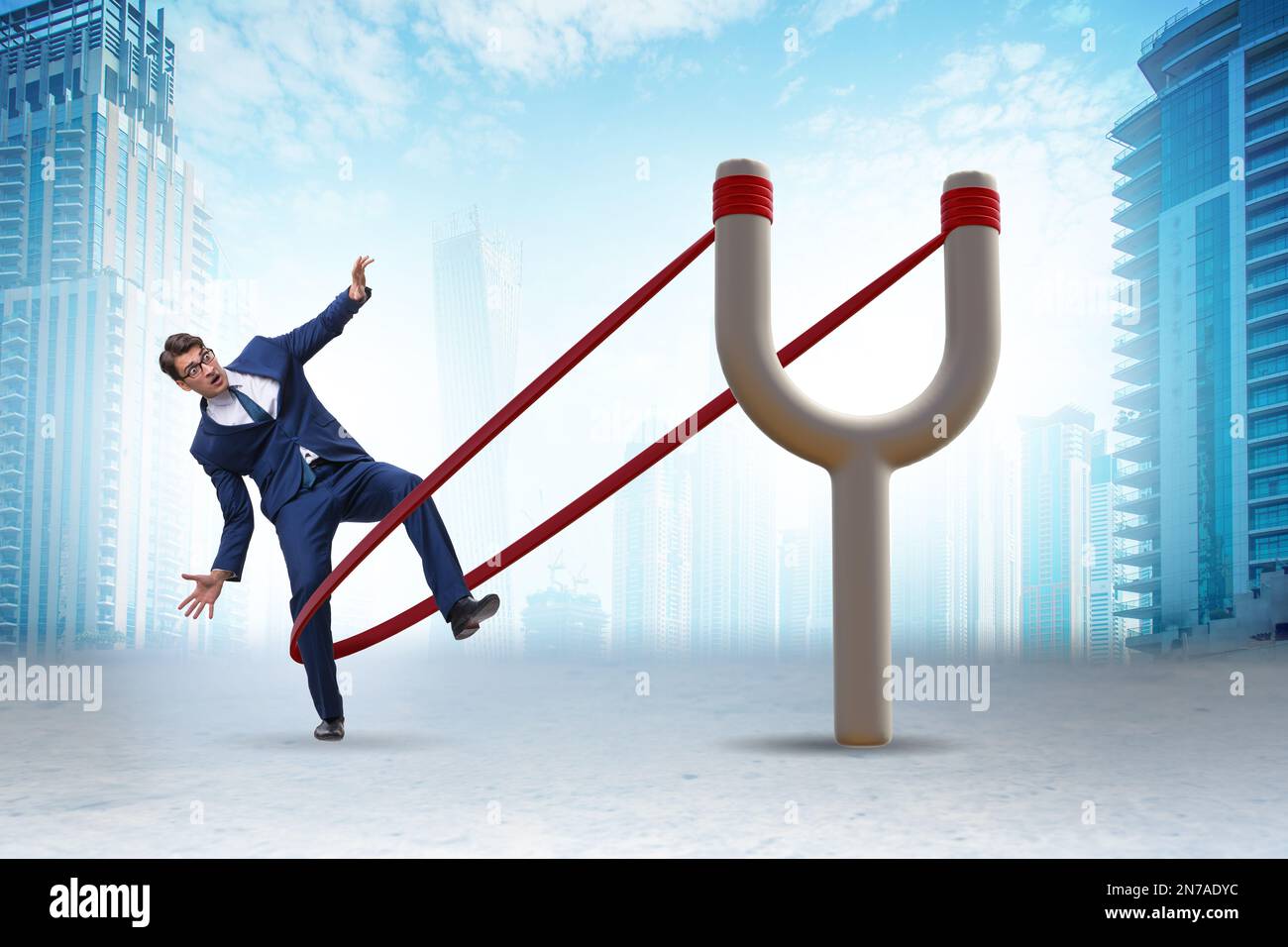 Businessman being launched from slingshot in the career concept Stock ...