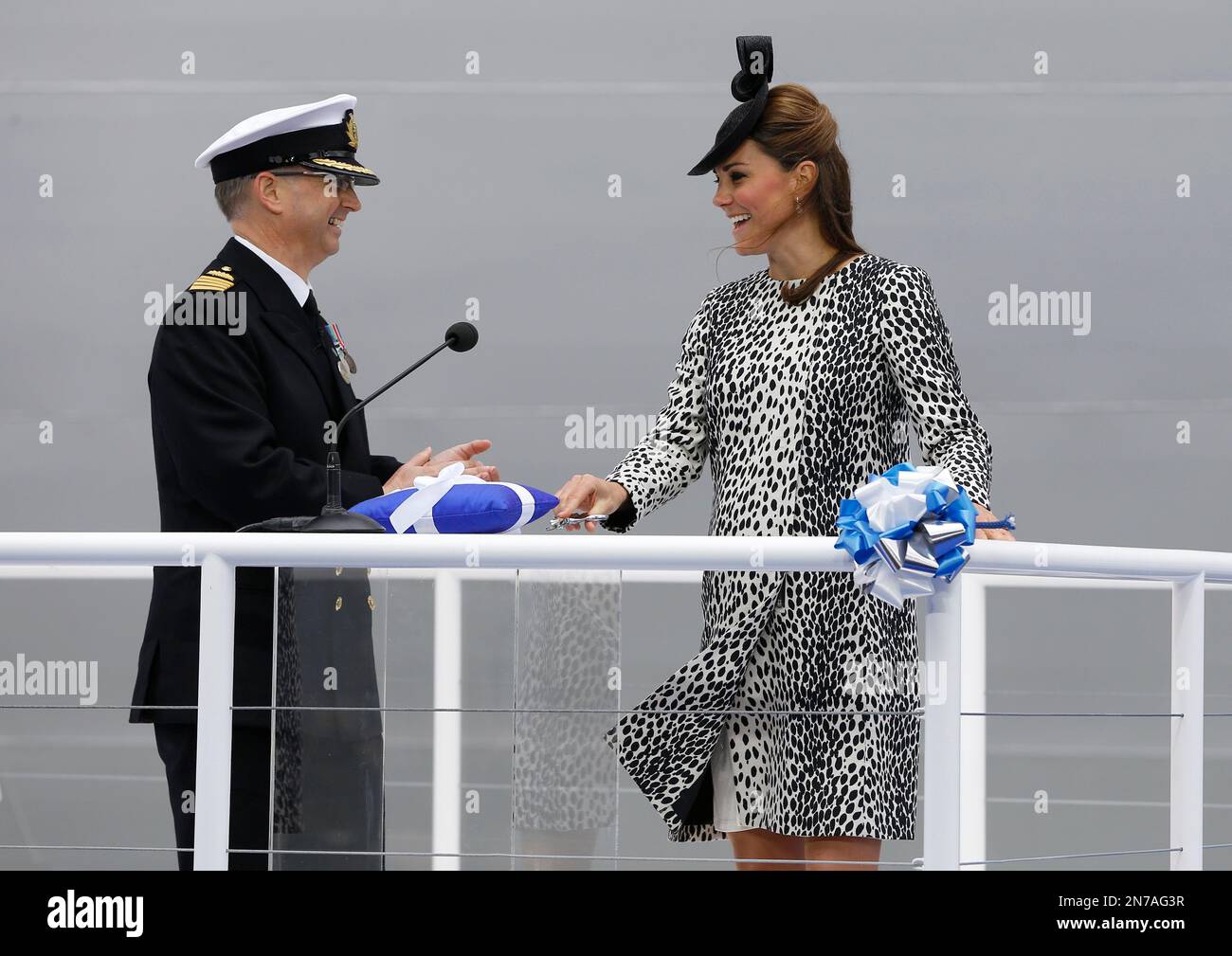Britain's Kate, the Duchess of Cambridge smiles at Captain Tony Draper ...