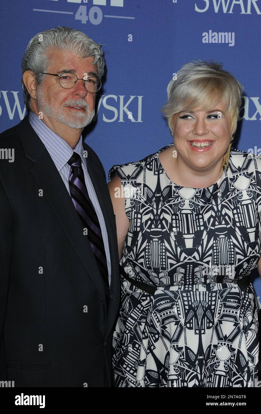 George Lucas, at left, and his daughter, Katie Lucas arrives at Women ...