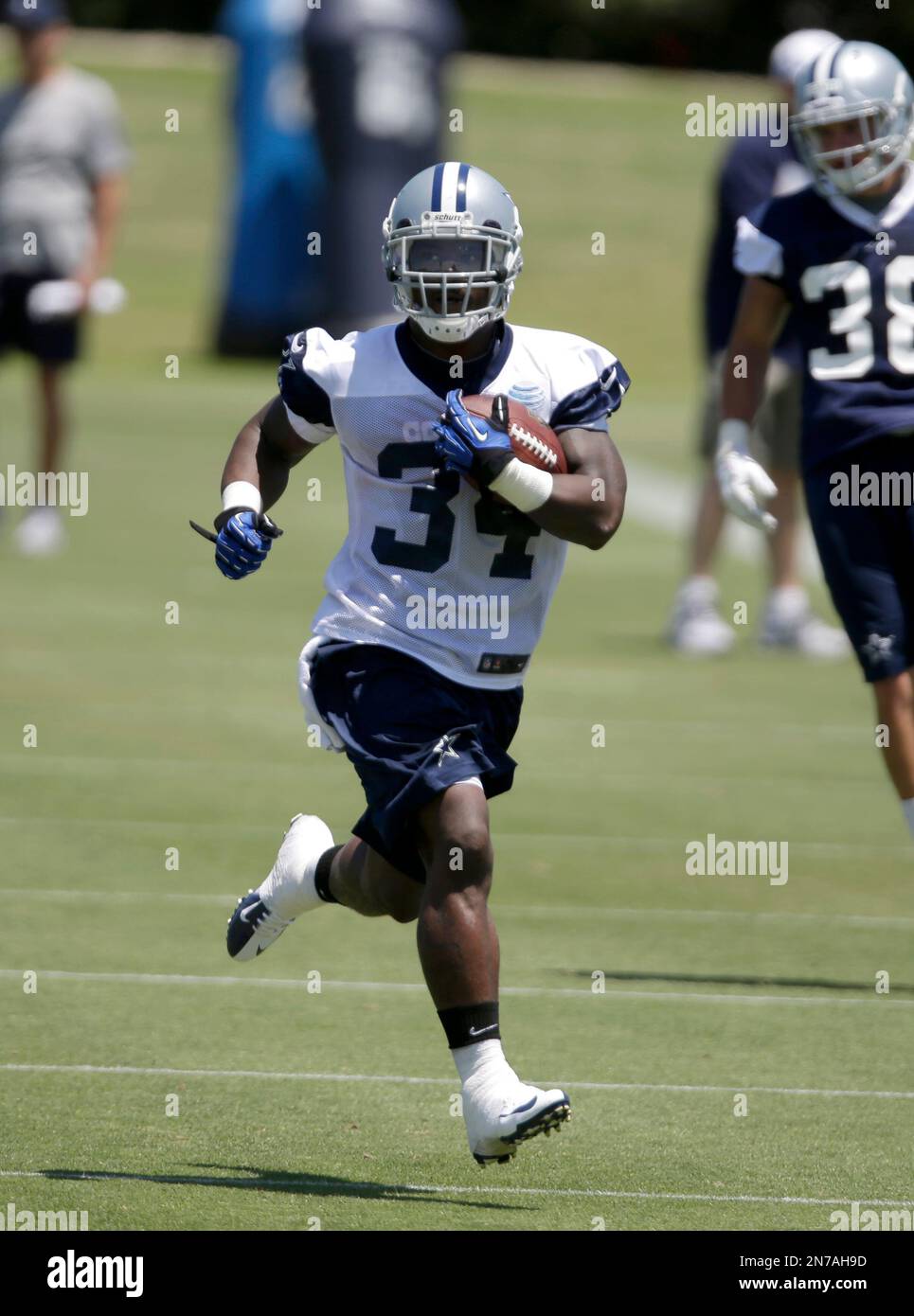 Dallas Cowboys running back Phillip Tanner (34) carries the ball up ...