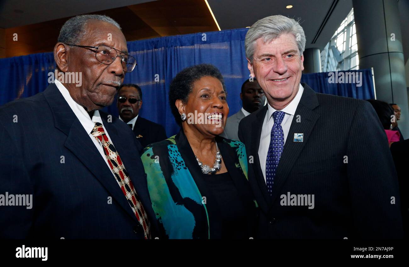 Gov. Phil Bryant, right, joins Myrlie Evers-Williams, center and her ...