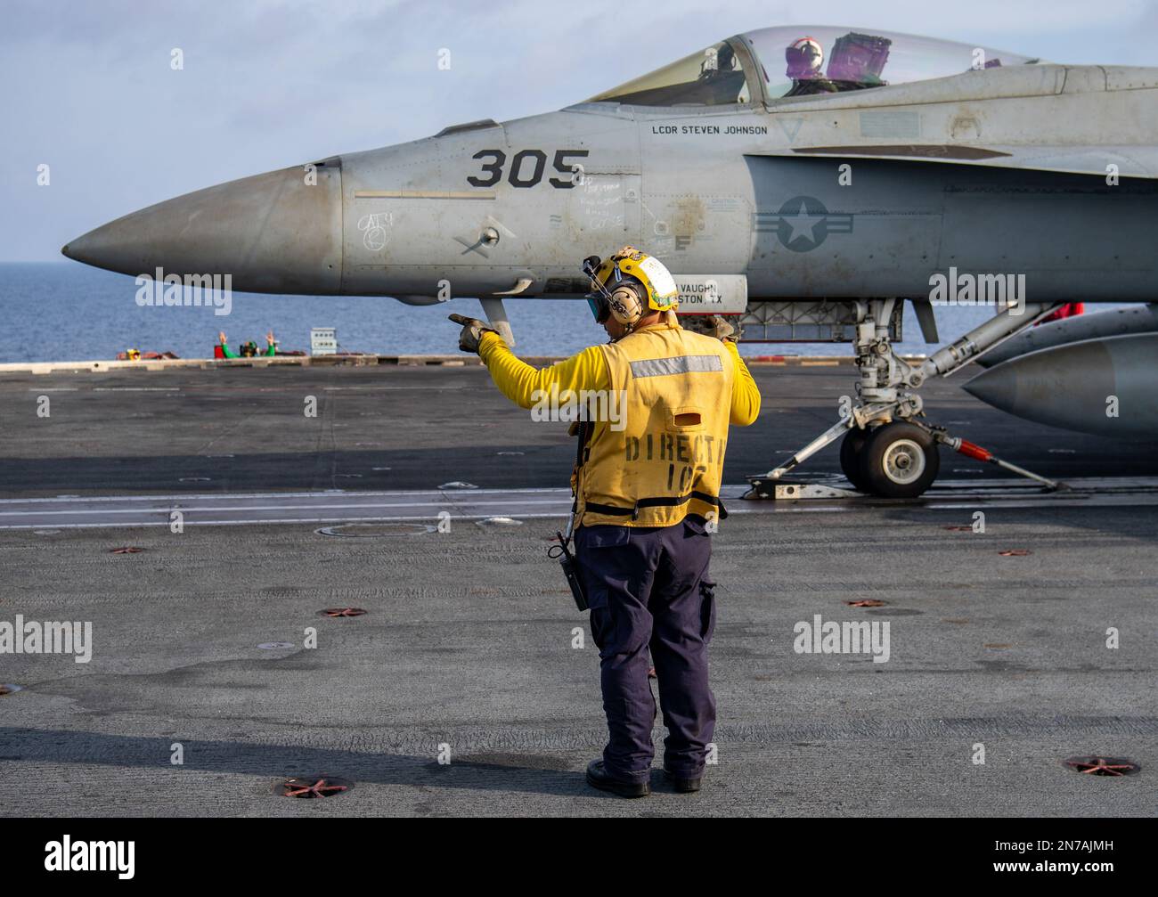 230209-N-DU622-1494 SOUTH CHINA SEA (Feb. 9, 2023) A U.S. Navy Sailor prepares to launch an F/A ...