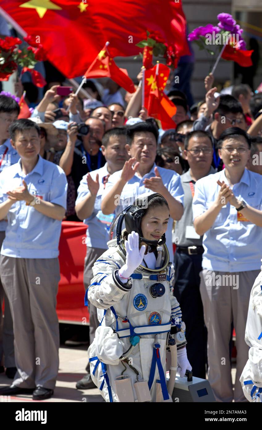 China's female astronaut Wang Yaping waves as she departs for the ...