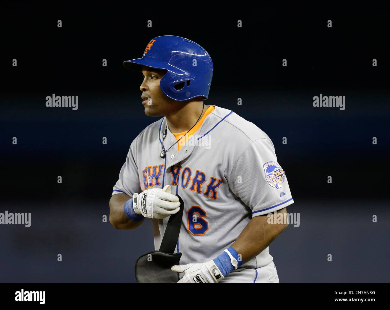 New York Mets right fielder Marlon Byrd removes his batting gear in an ...