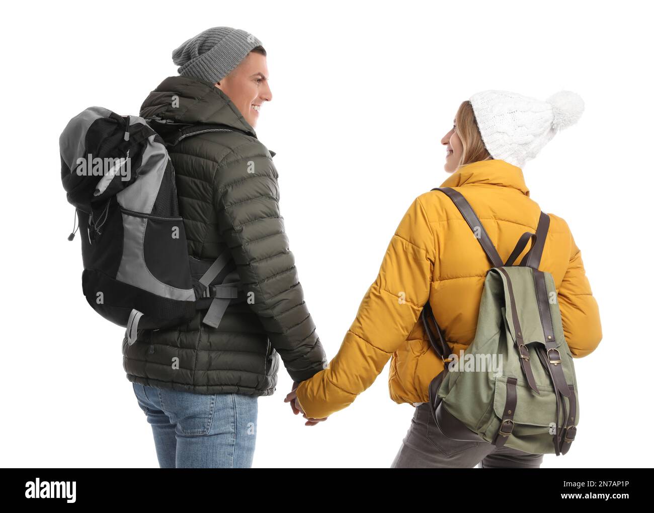 Couple with backpacks on white background, back view. Winter travel ...