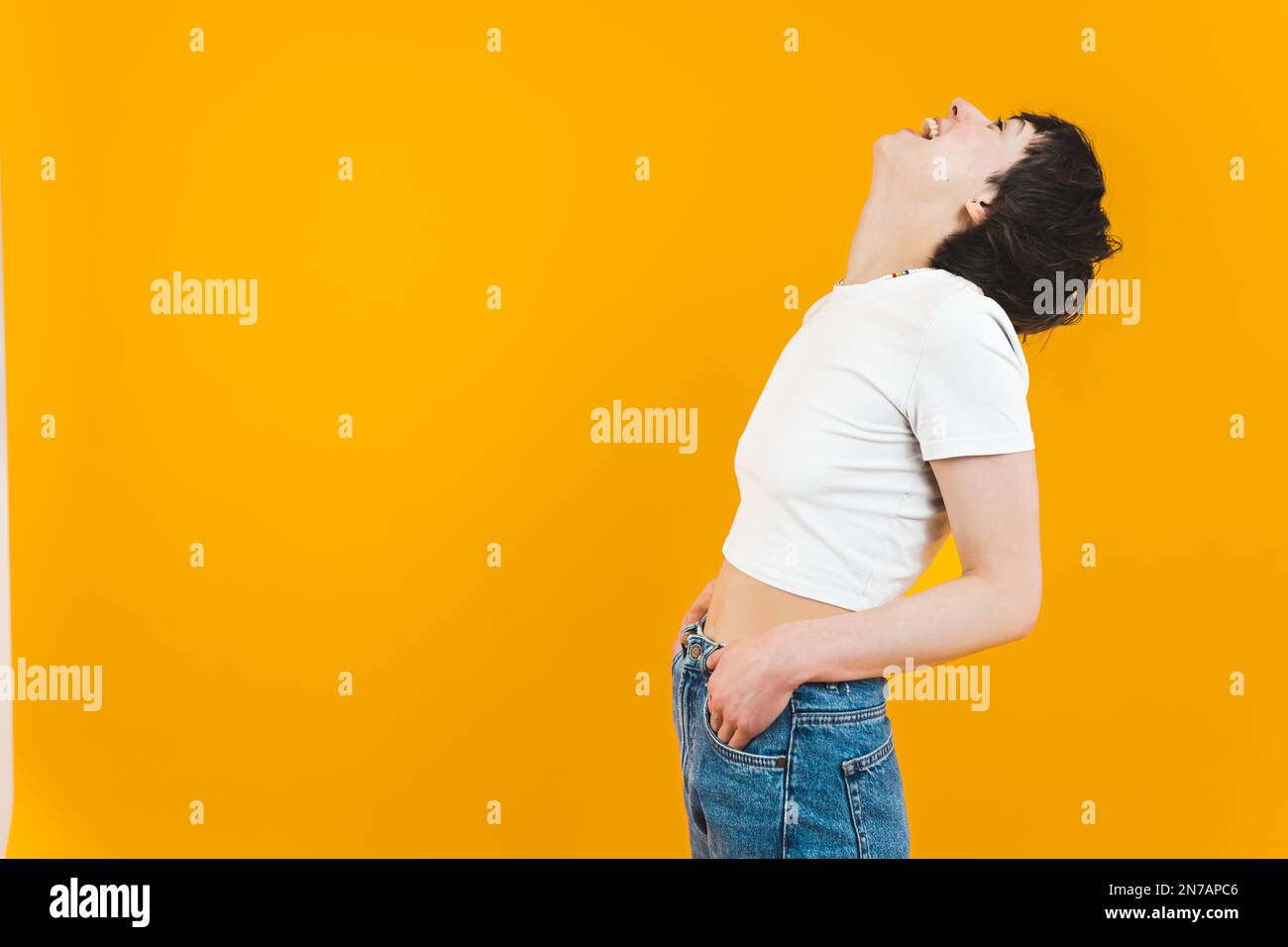 Laughter and positive emotions. Woman loudly laughing with her head ...