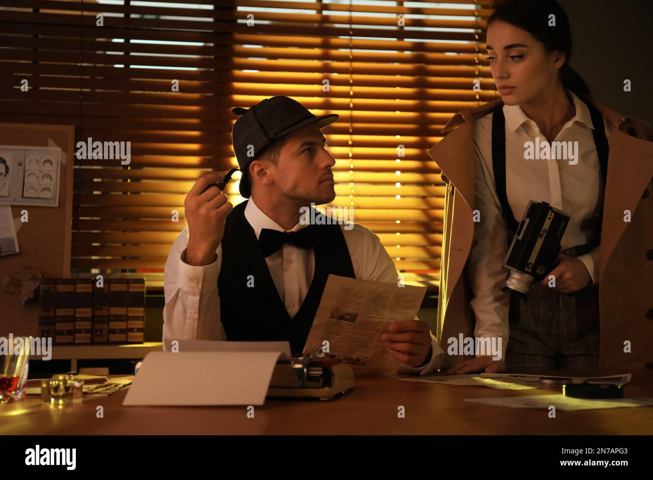 Old fashioned detective and his colleague working in office Stock Photo ...