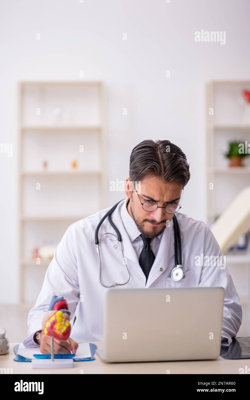 Young doctor cardiologist working at the hospital Stock Photo - Alamy