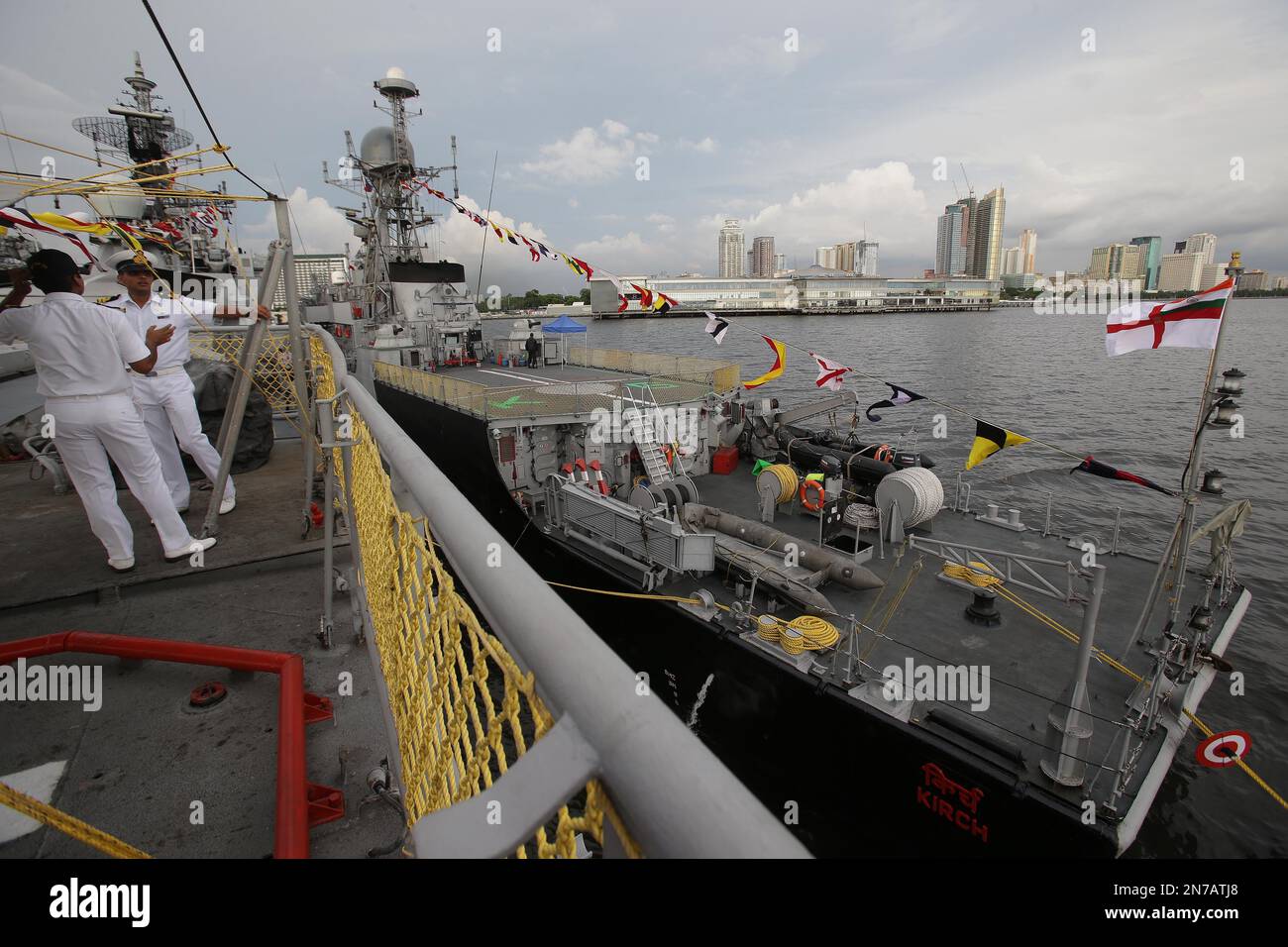 Indian sailors talk onboard the INS Ranvijay (D55), a Rajput class ...