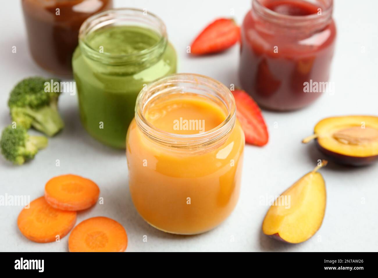 Healthy baby food and ingredients on grey background Stock Photo - Alamy