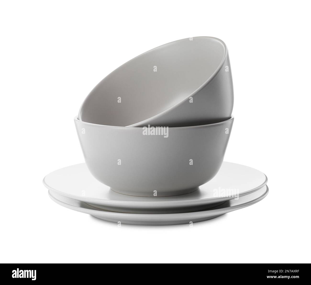 Stack of clean plates and bowls on white background Stock Photo - Alamy