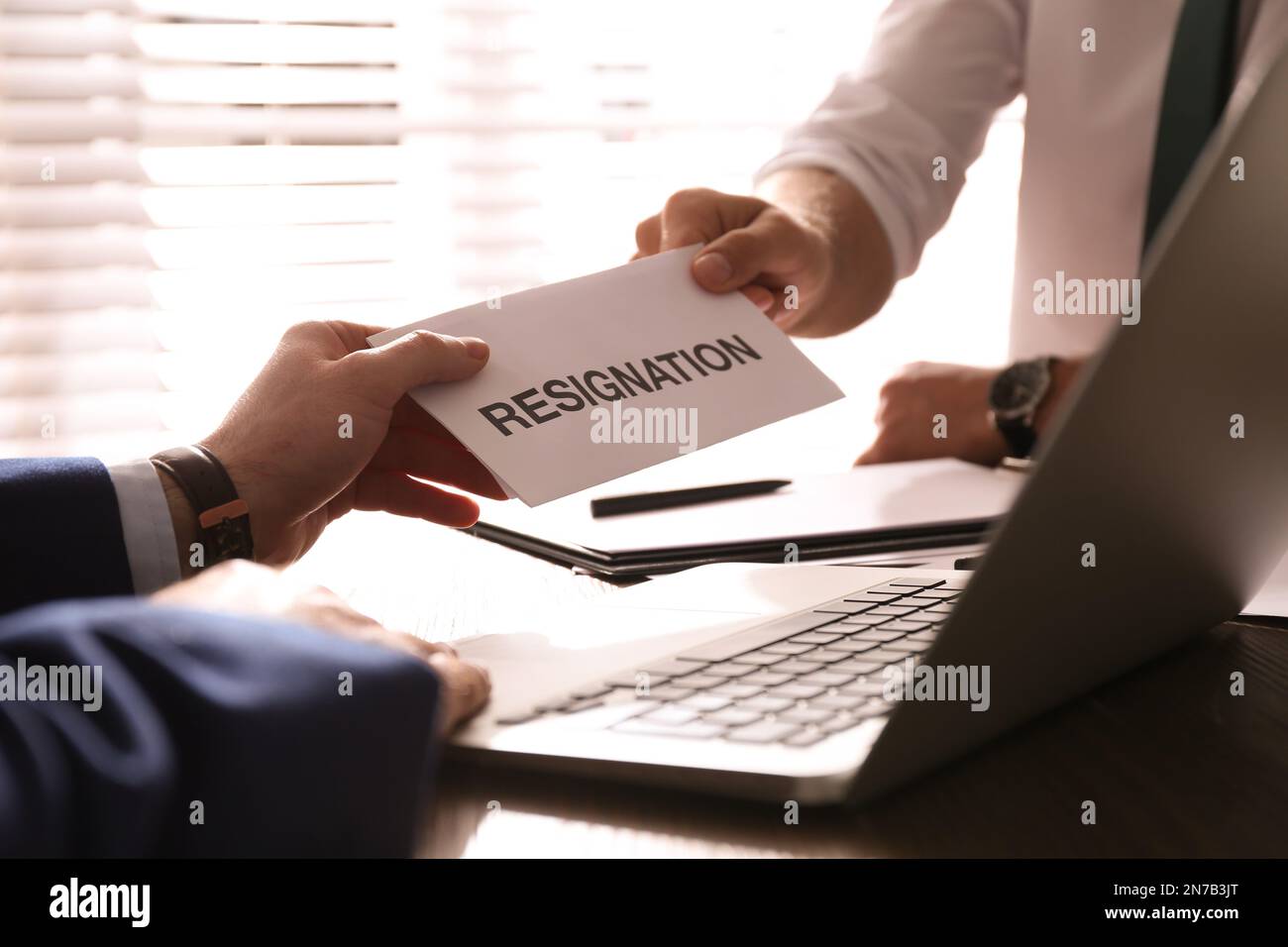 Employee giving resignation letter to boss in office, closeup Stock ...