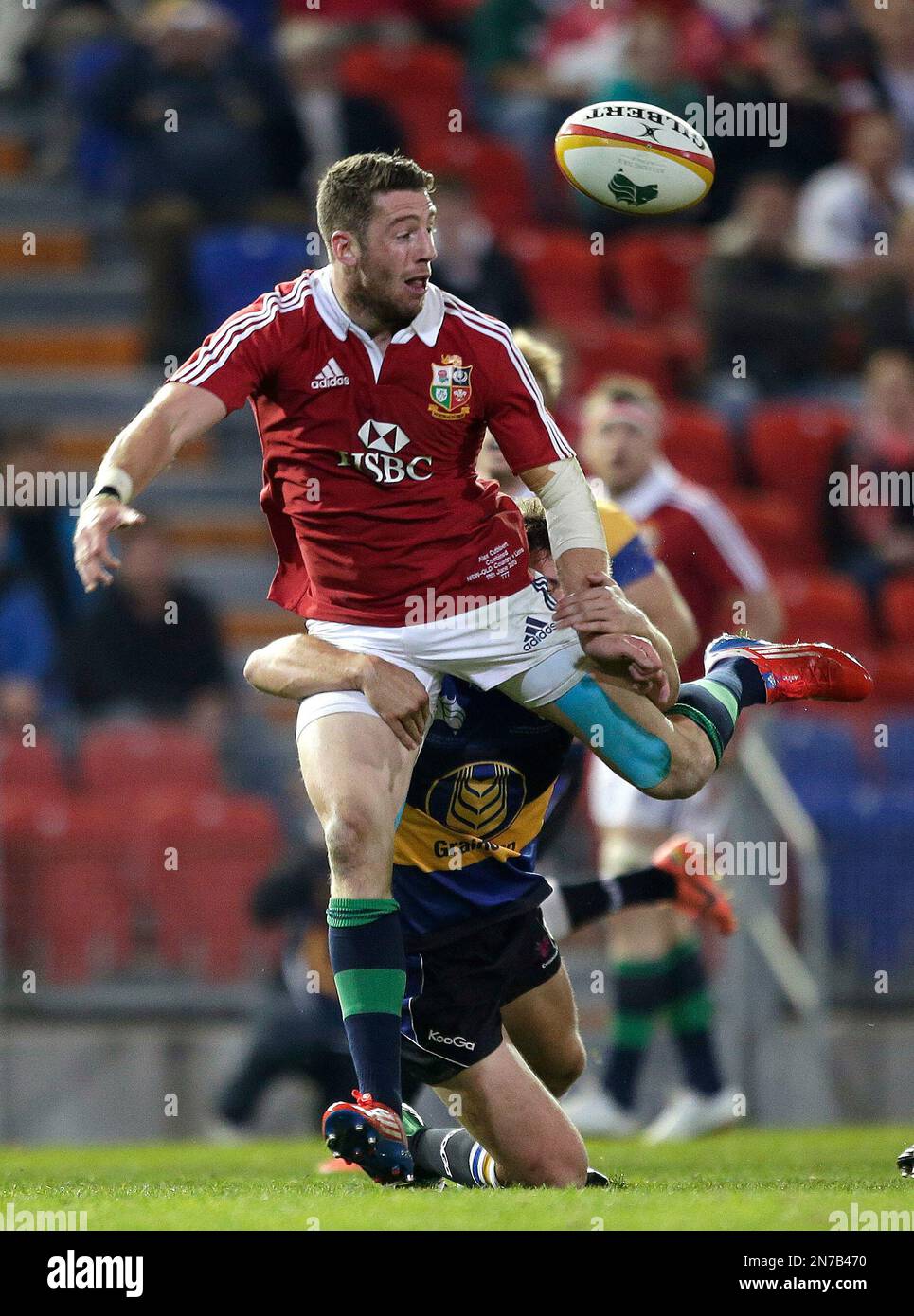 British and Irish Lions Alex Cuthbert is tackled by Combined Countries ...