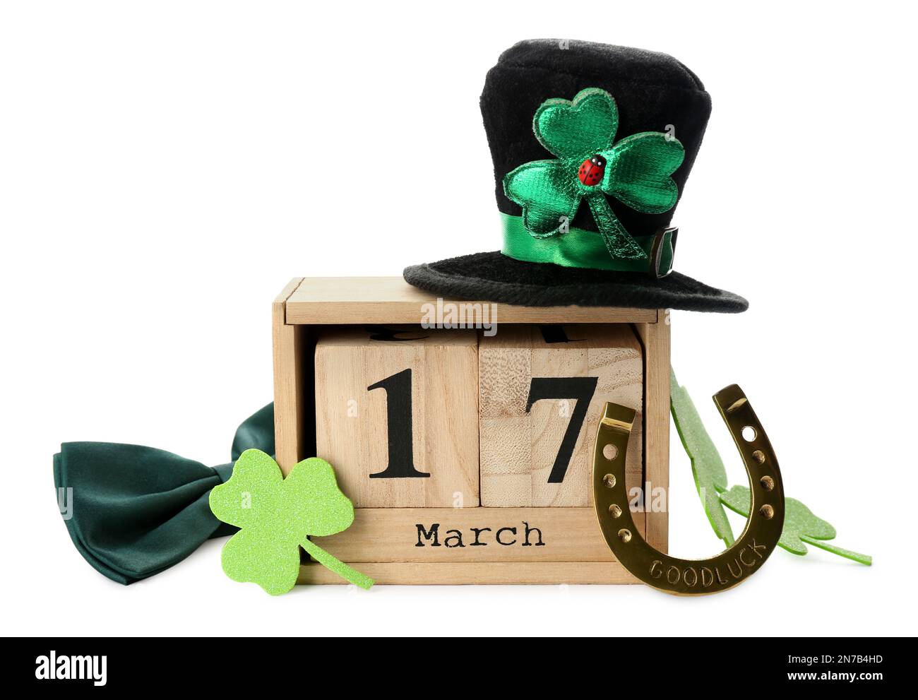 Leprechaun's hat, block calendar and St. Patrick's day decor on white ...