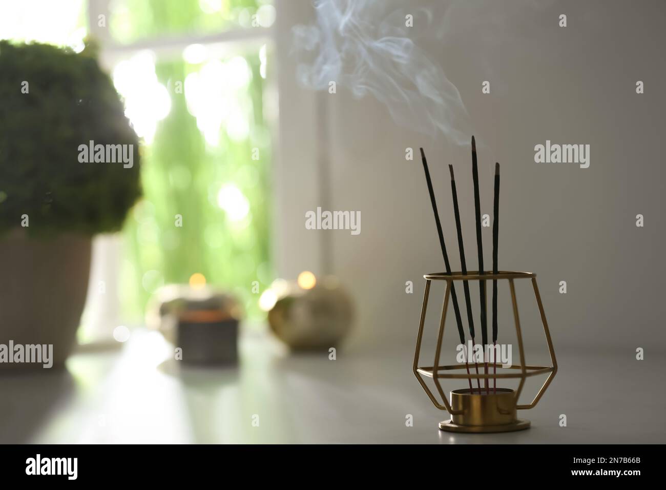 Burning incense sticks in room hi-res stock photography and images - Alamy
