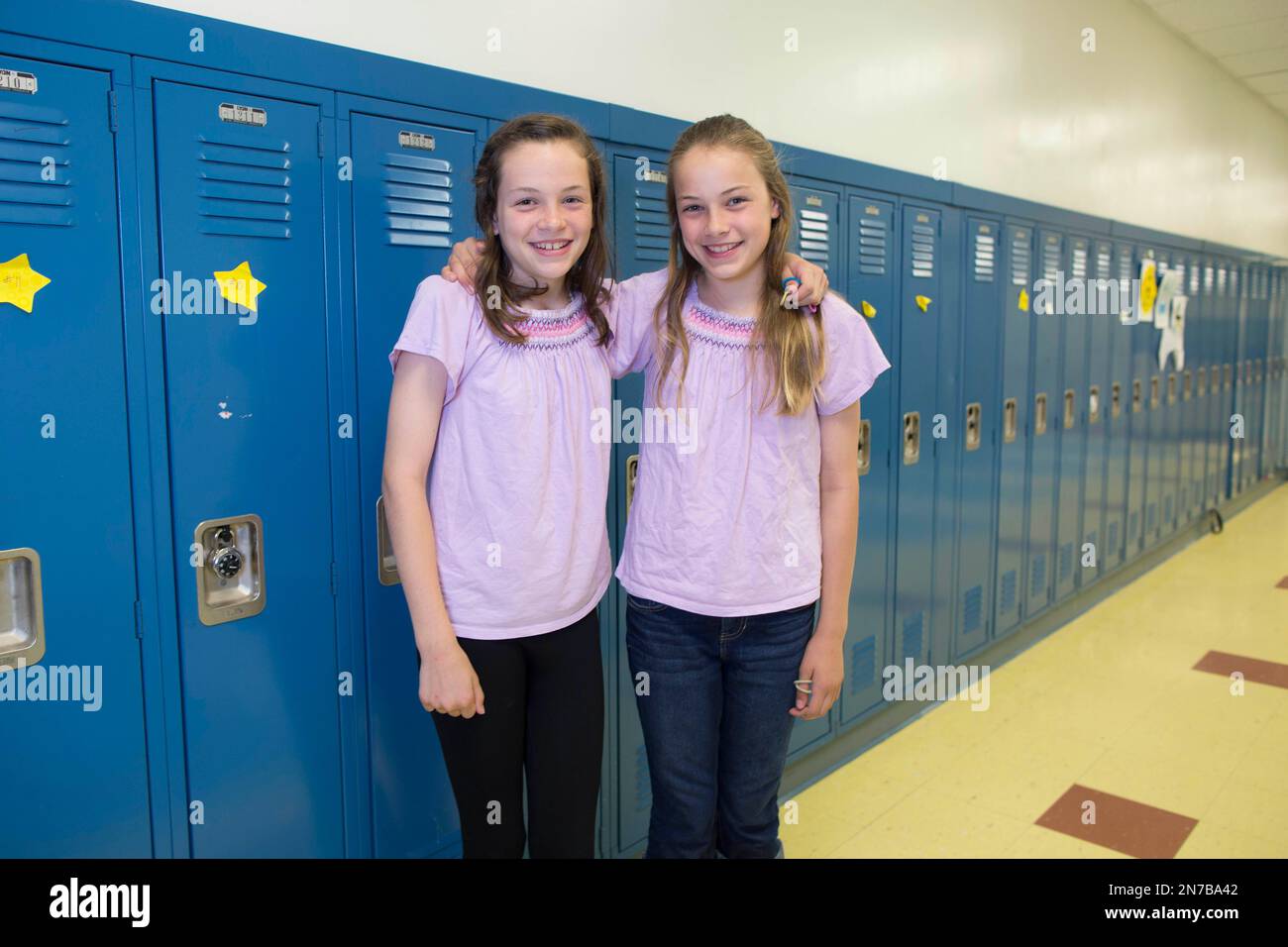 In this Thursday, June 6, 2013 photo, Emma Merk, left, and her twin ...