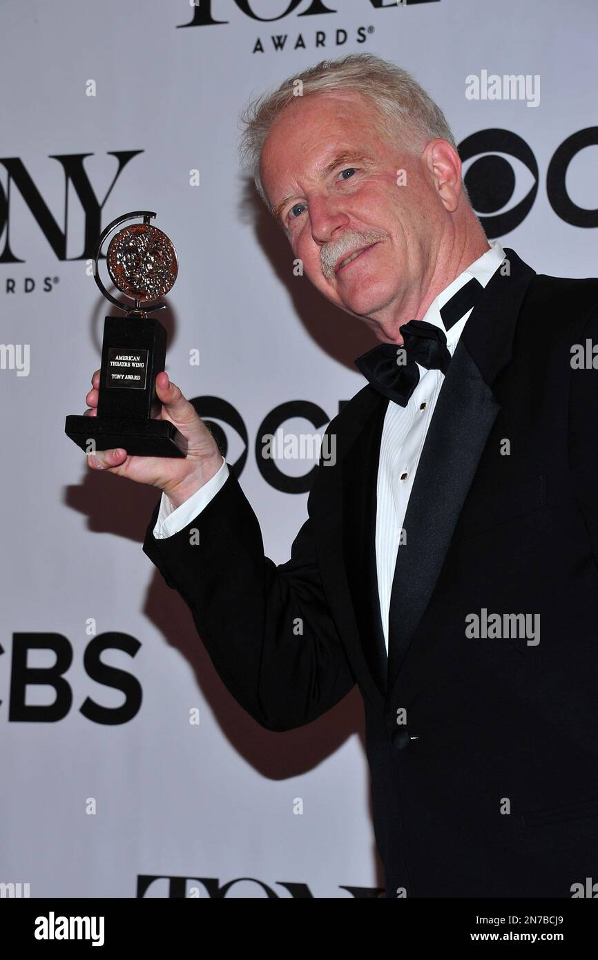John Lee Beatty poses with his award in the press room at the 67th ...