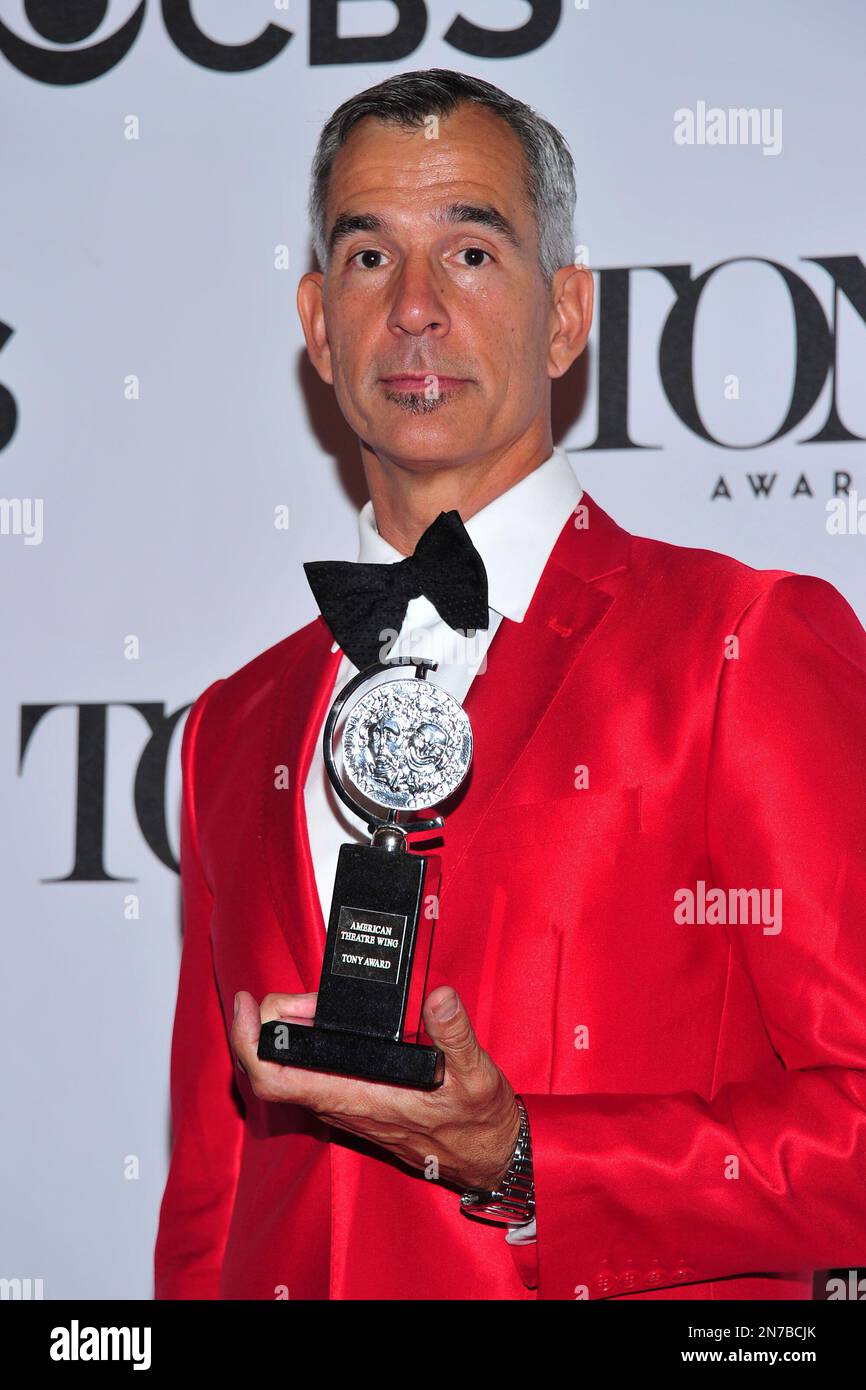 Jerry Mitchell poses with his award in the press room at the 67th ...