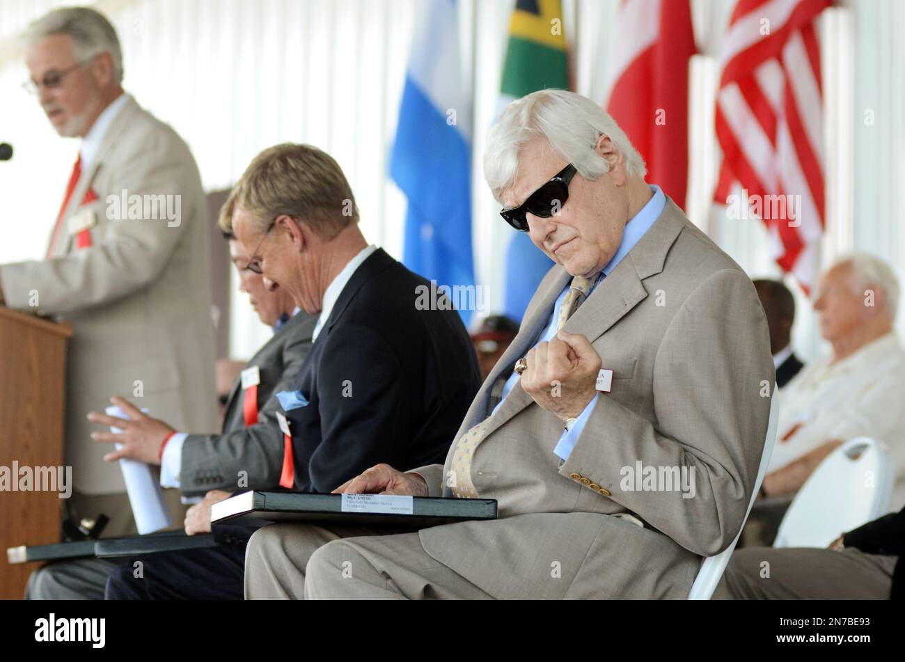 Boxing journalist Colin Hart, center, checks out his newly acquired ...