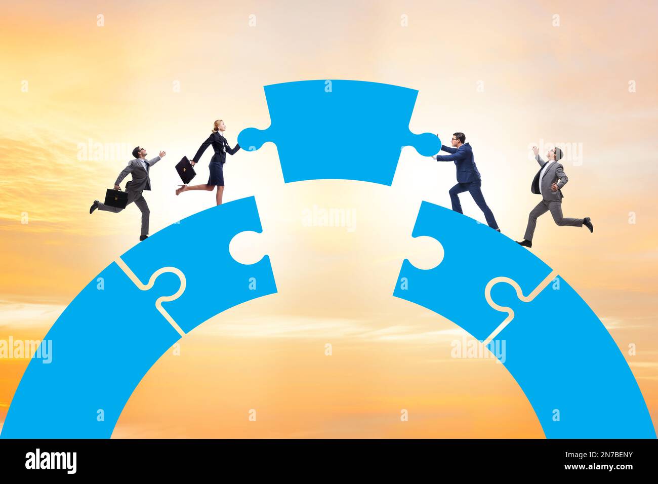 Business people building bridge in the teamwork concept Stock Photo - Alamy