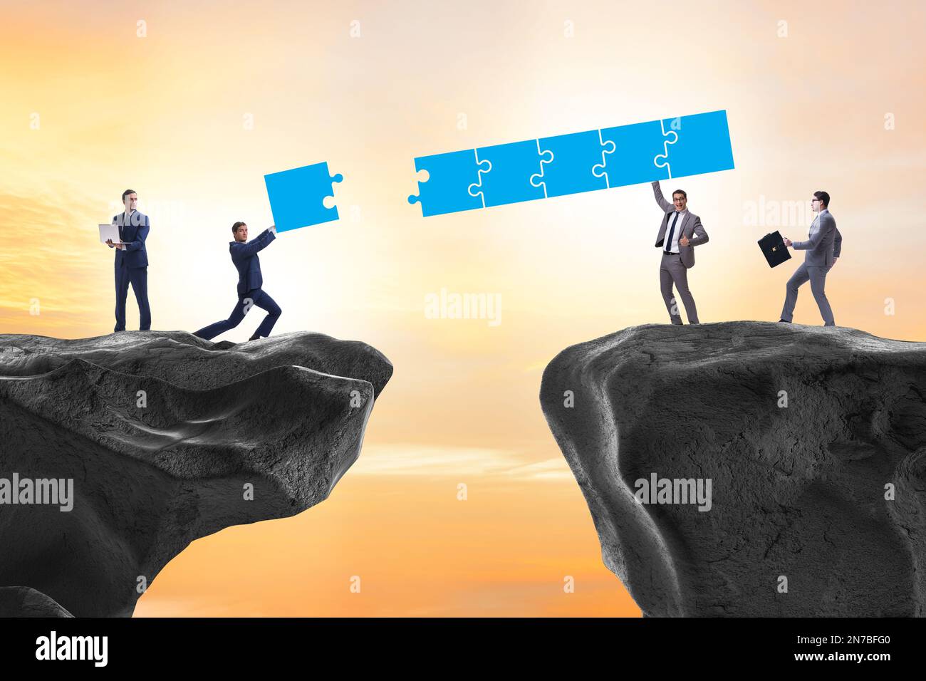 Concept of teamwork with the bridge being built Stock Photo - Alamy