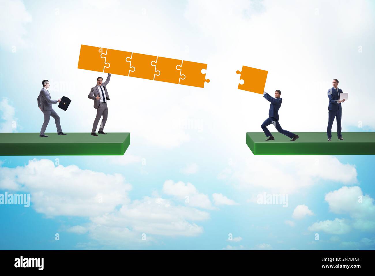 Concept of teamwork with the bridge being built Stock Photo - Alamy