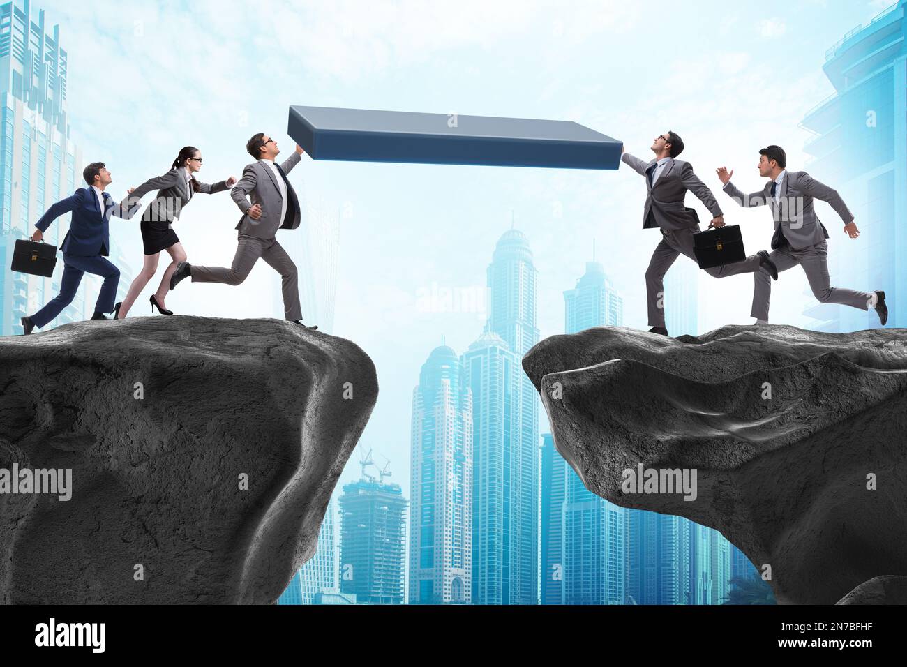 Concept of teamwork with the bridge being built Stock Photo - Alamy