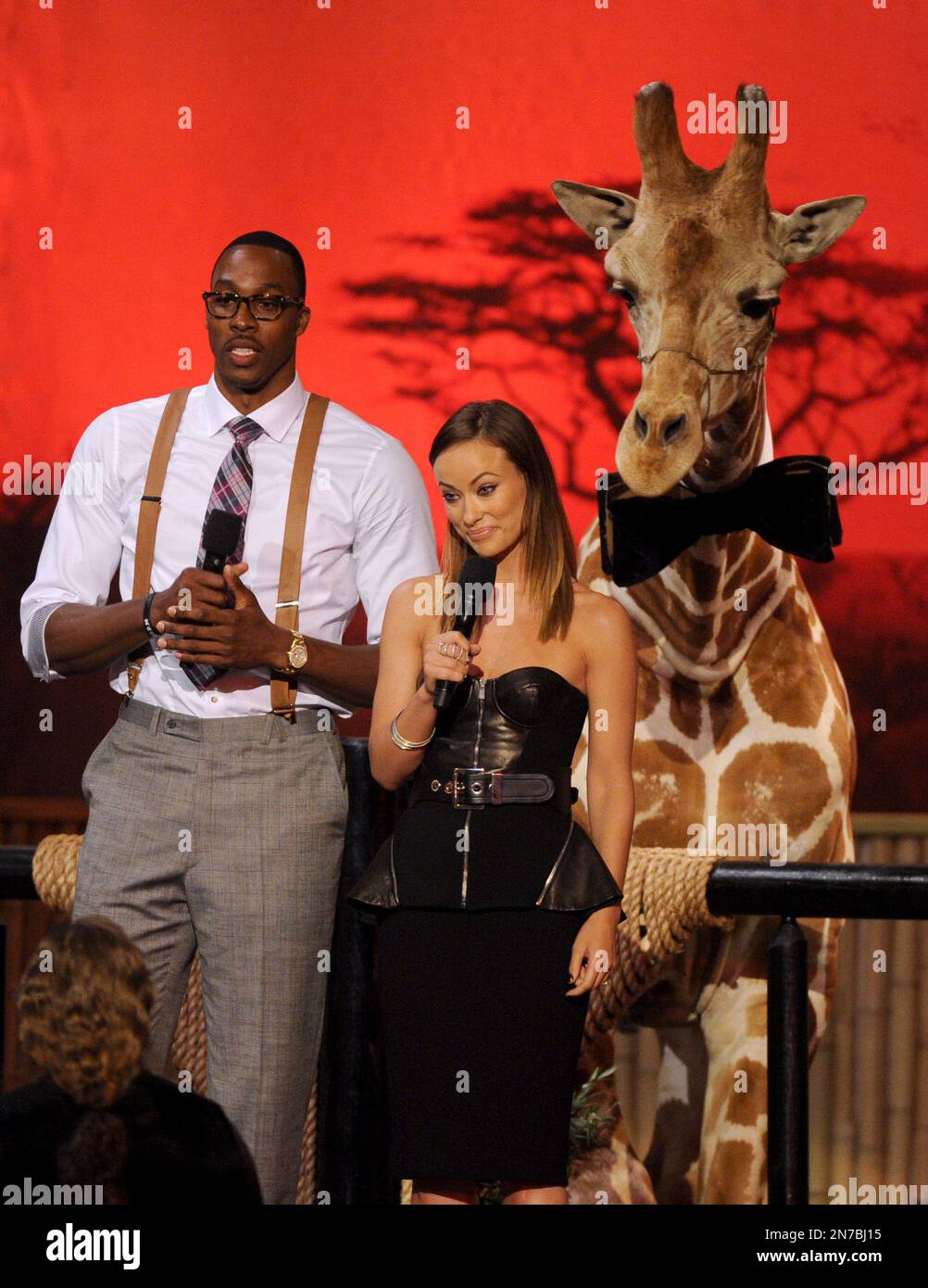 Dwight Howard, left, and Olivia Wilde present the stand up of the year ...