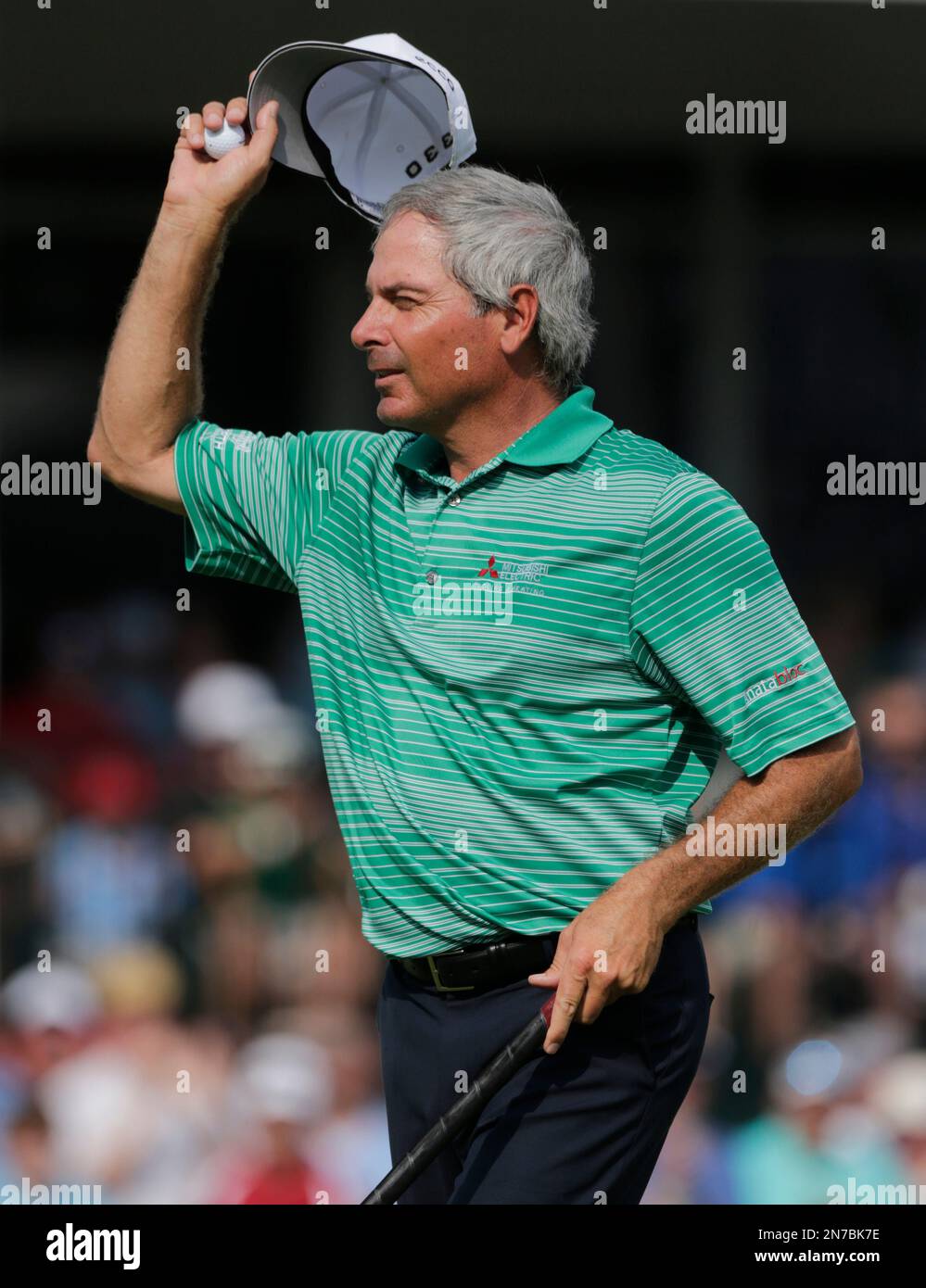Fred Couples tips his cap after completing his third round play in the ...