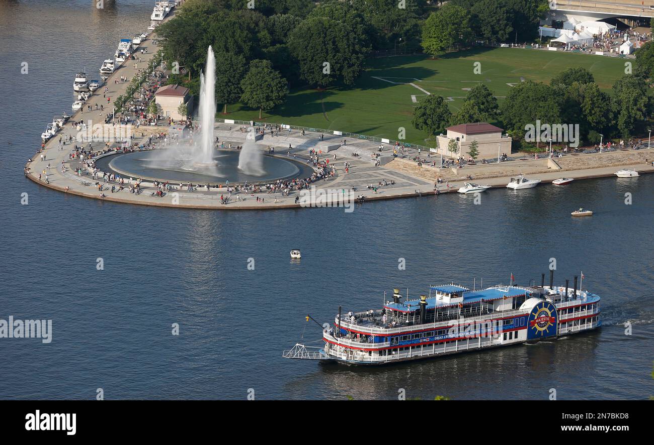 An excursion river boat moves down the Monongahela River past the newly ...