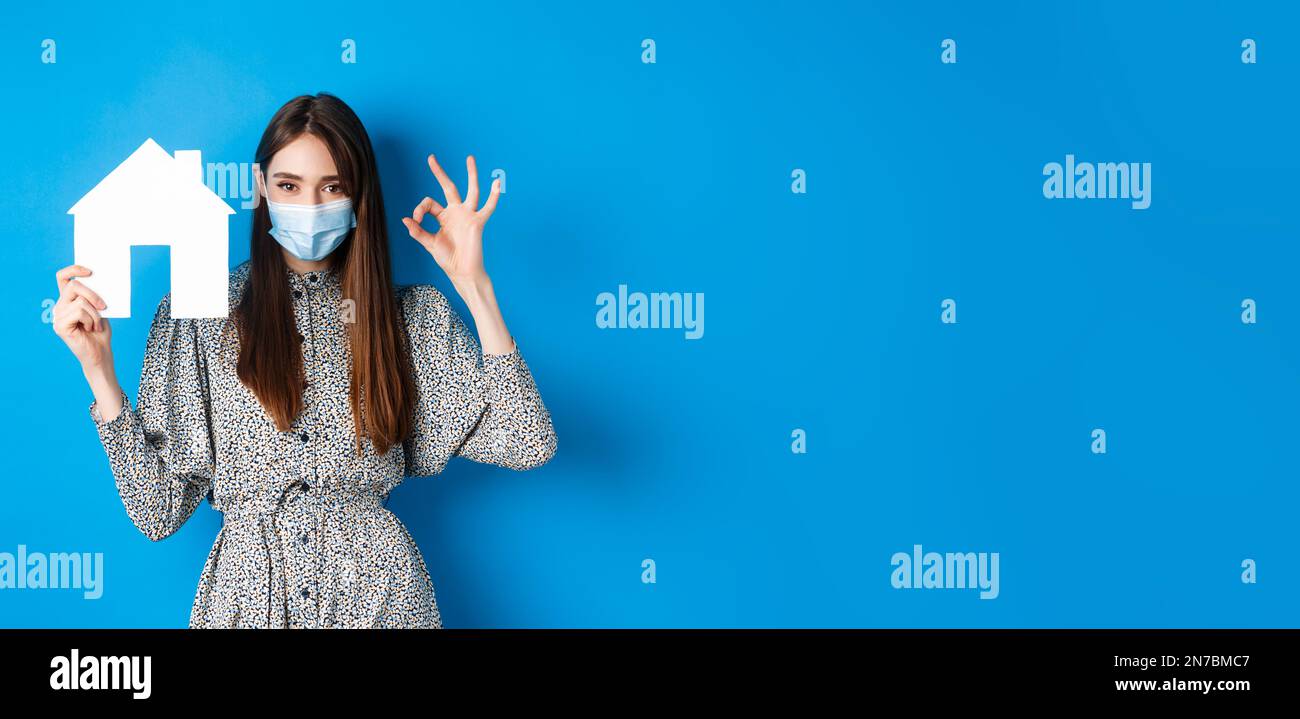 Real estate, covid-19 and pandemic concept. Candid woman in medical ...