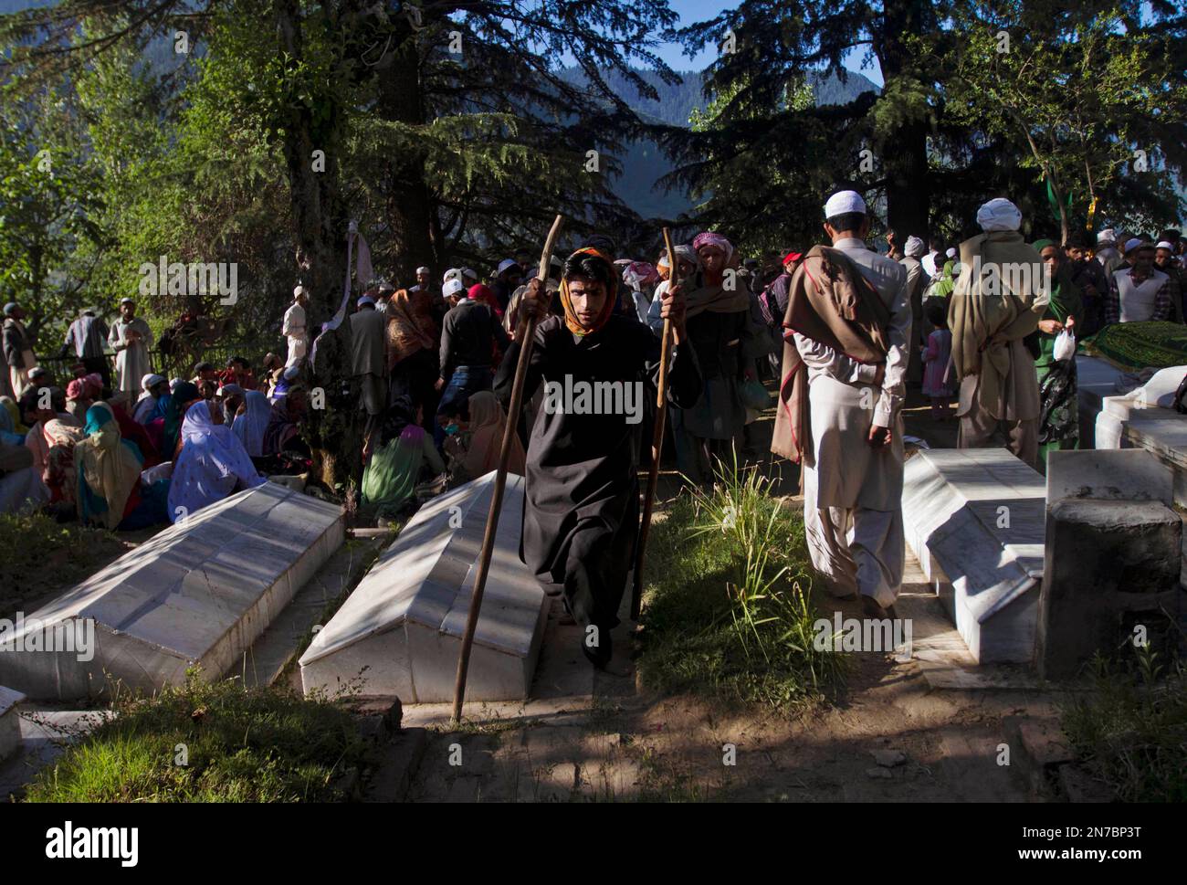 A disabled Kashmiri Muslim nomad Gujjar walks with the help of wooden ...