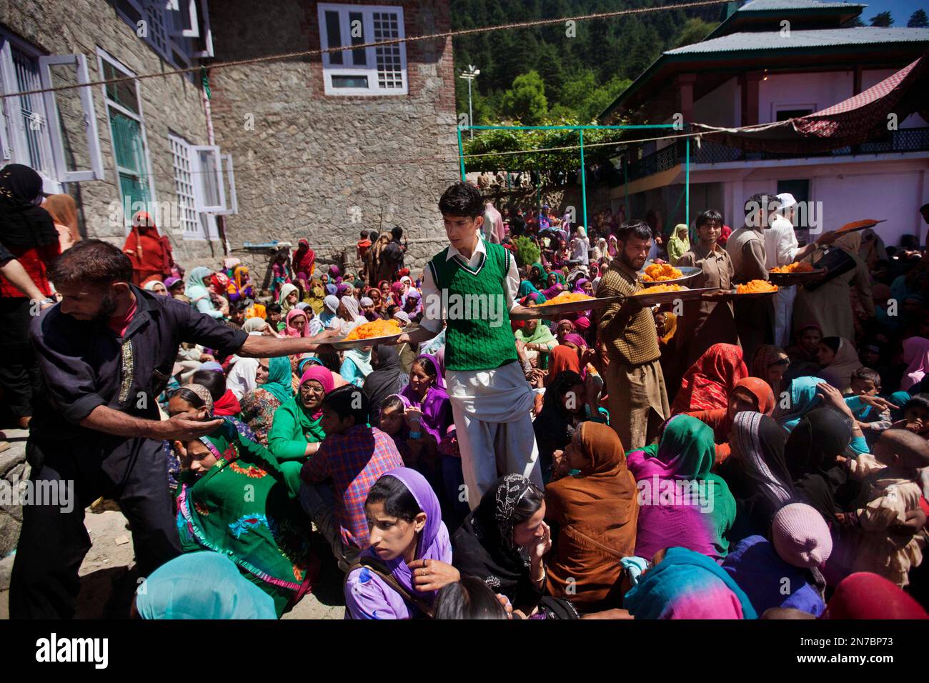 Kashmiri Muslims belonging to nomadic Gujjar tribe serve big platters ...