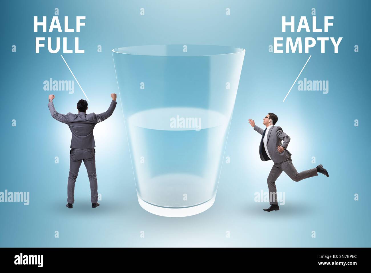 Businessman in the half empty half full glass concept Stock Photo - Alamy