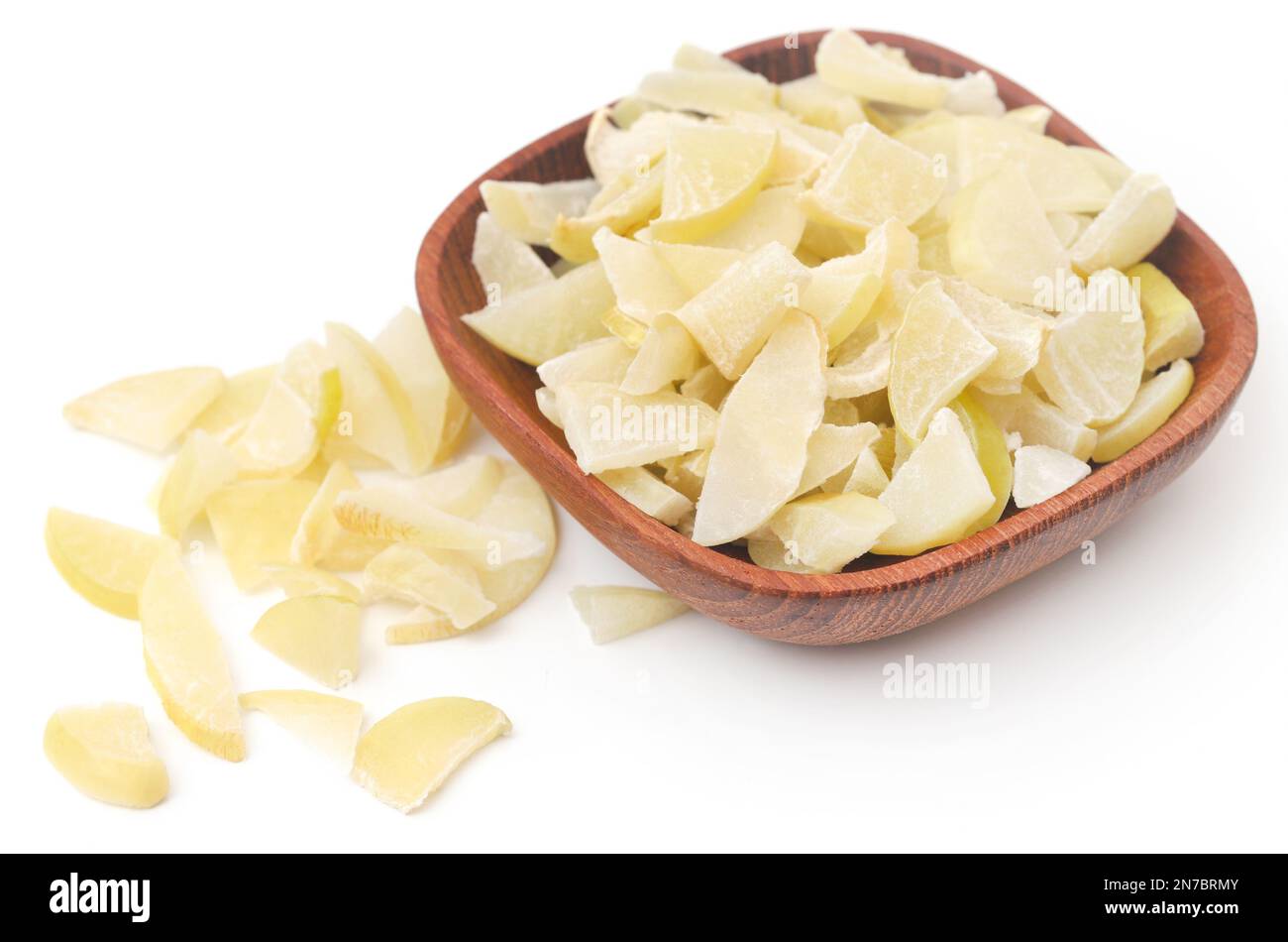 Sliced amla fruits closeup over white background Stock Photo - Alamy