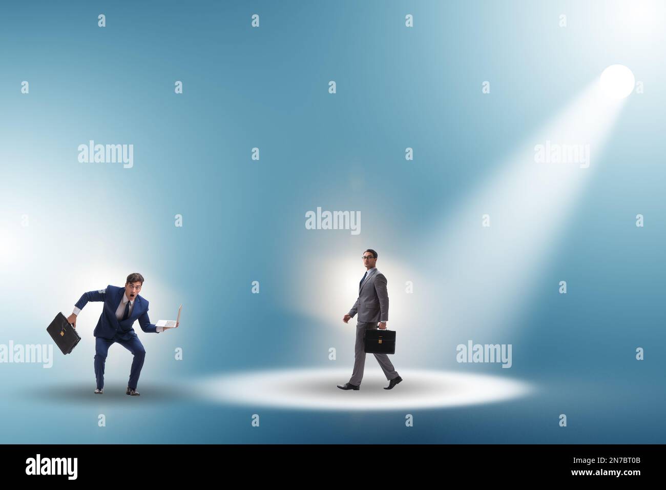 Business people under the spotlight concept Stock Photo - Alamy