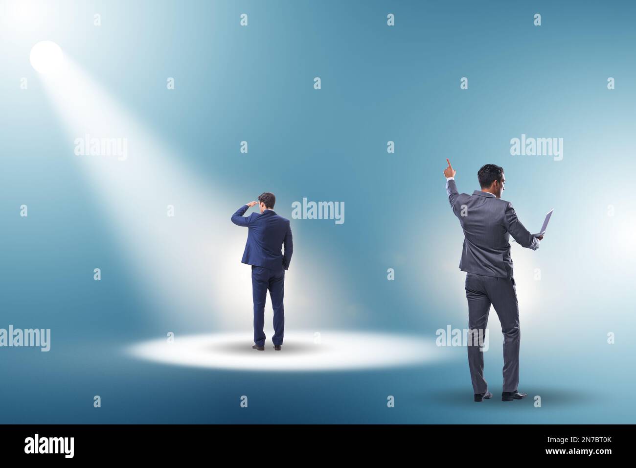 Business people under the spotlight concept Stock Photo - Alamy