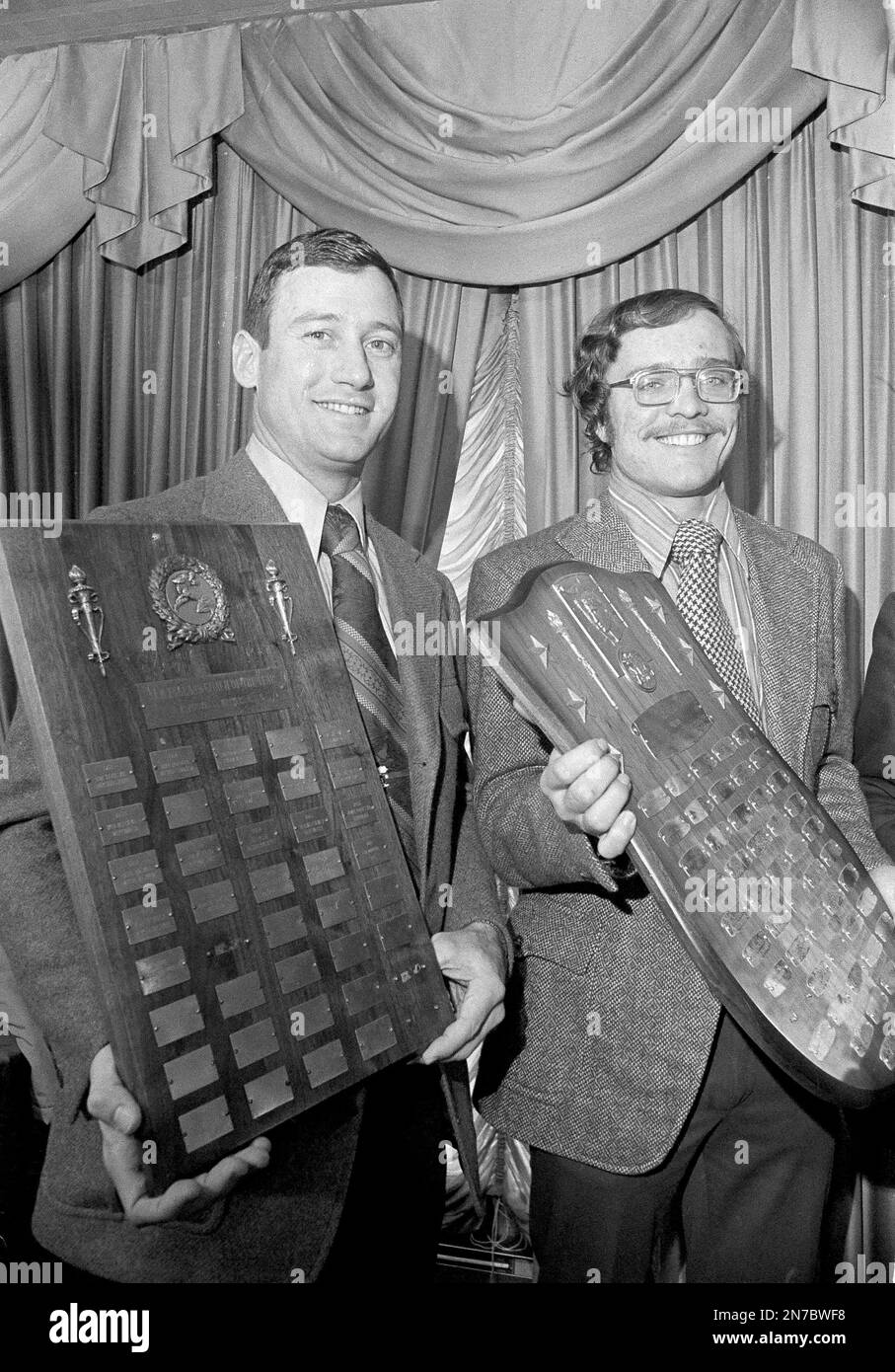 Jake Crouthamel, left, and Tom Csatari hold awards in Boston, Dec. 4 ...