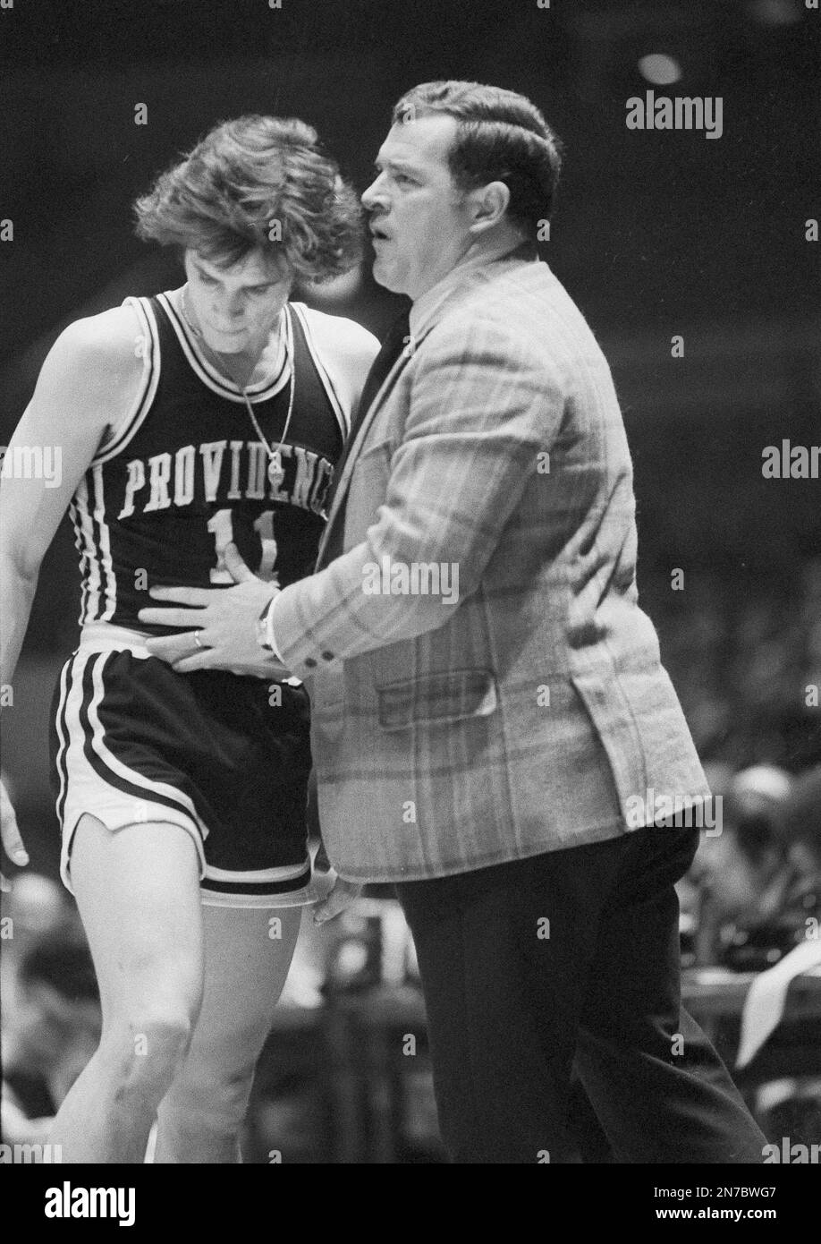 Providence coach Dave Gavitt talks with Gary Bello during time out in ...