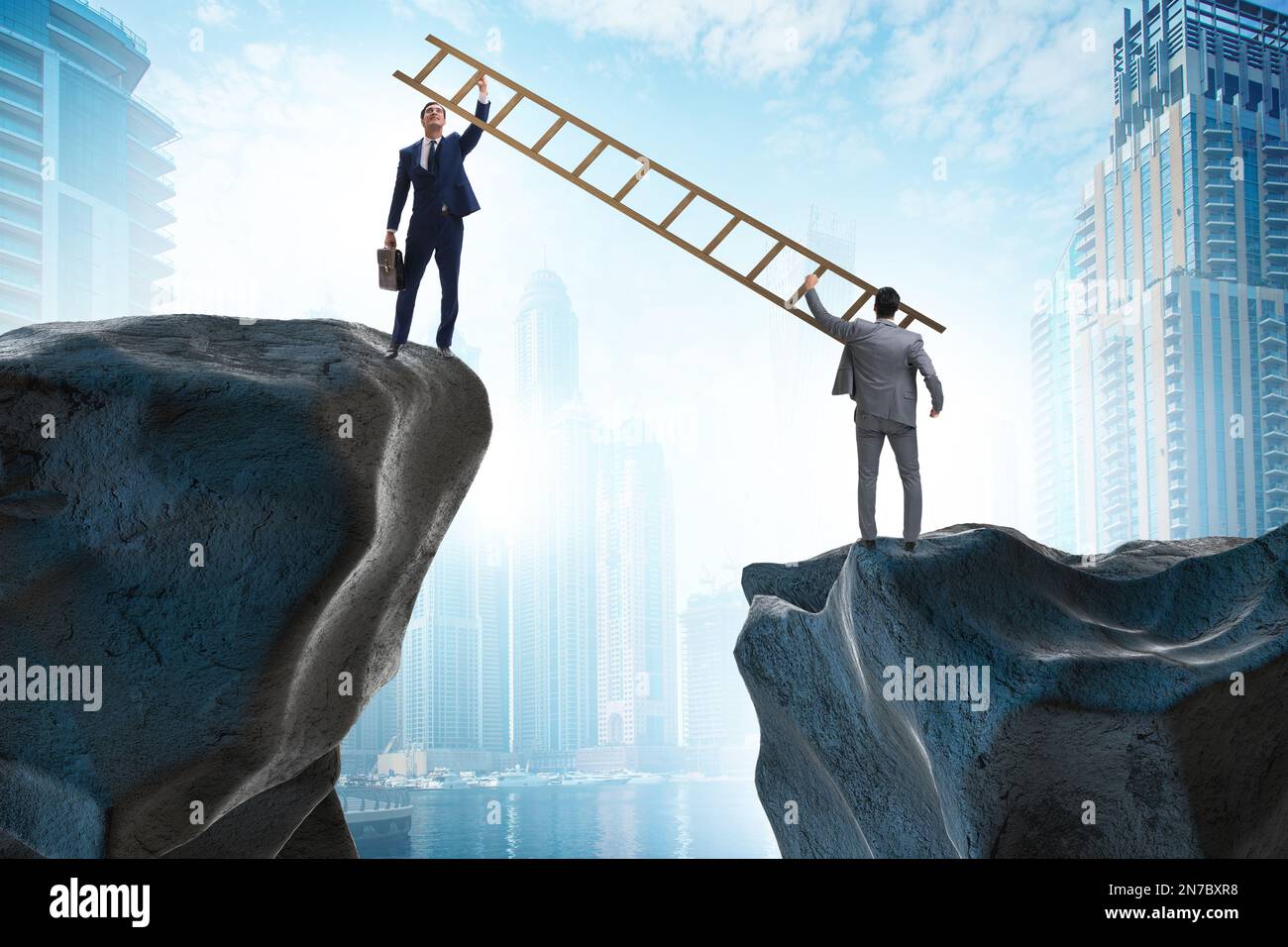 Business people helping to go over the chasm Stock Photo - Alamy