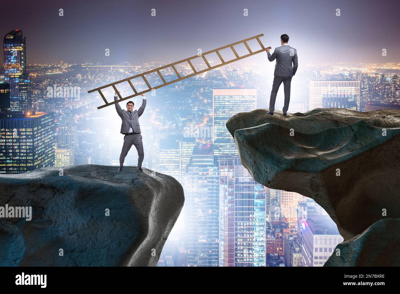 Business people helping to go over the chasm Stock Photo - Alamy